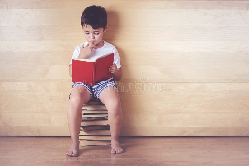 Boy reading a book stock image. Image of grow, read, dictionary - 60423565