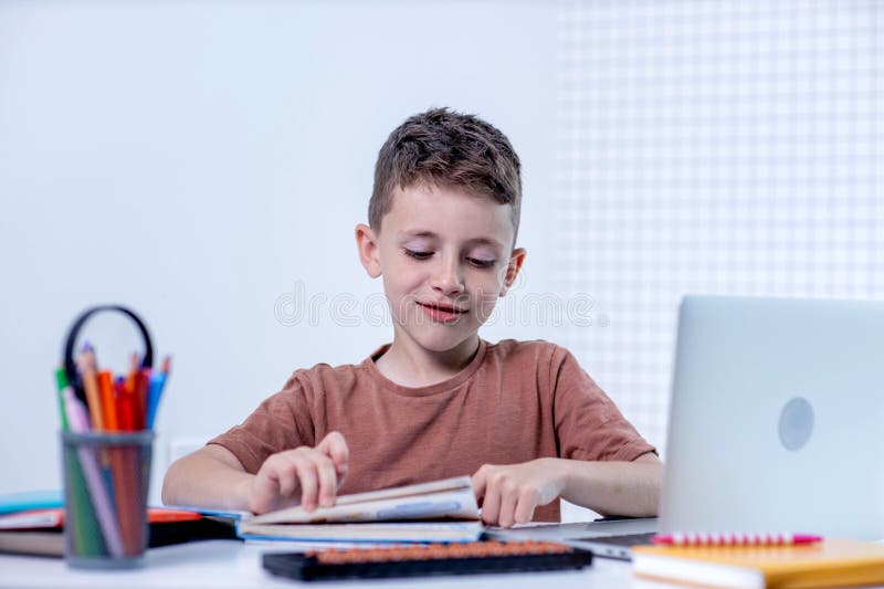 Boy Reading Book at the Table at Home Stock Image - Image of schoolkid ...