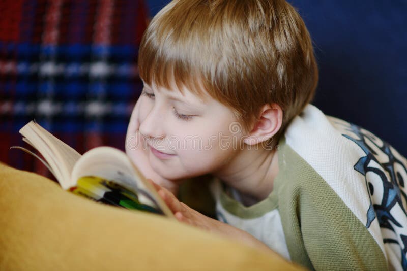 Boy reading at home stock photo. Image of pensive, reading - 30929302