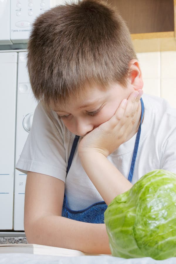 Boy reading at kitchen stock image. Image of person, dependence - 20791241