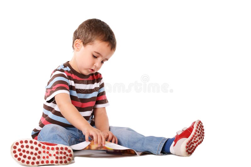 Boy reading magazine stock photo. Image of book, full - 16635214