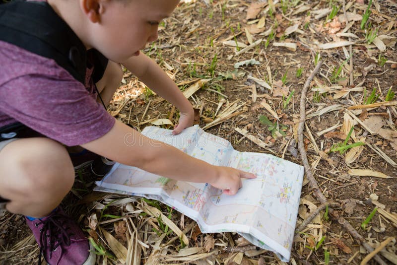 Boy Reading the Map in the Forest Stock Photo - Image of direction ...