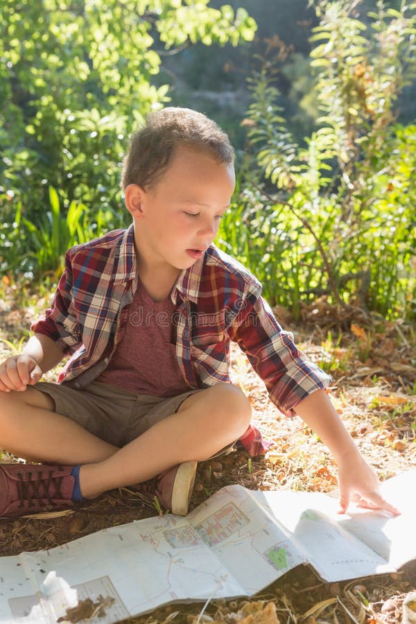 Boy Reading the Map in the Forest Stock Photo - Image of destination ...
