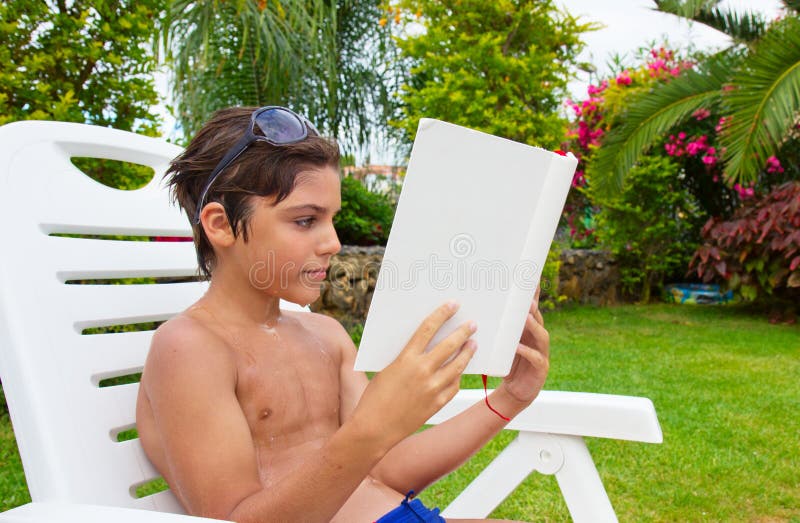 Boy reading on summer lawn stock image. Image of pensive - 25352037