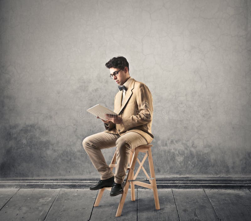 Boy reading from a tablet stock image. Image of young - 46722489