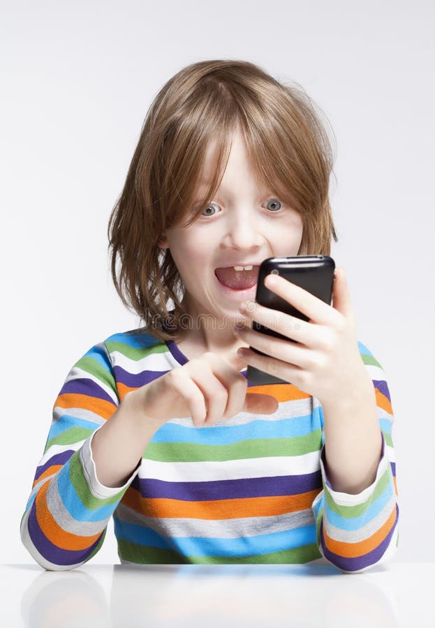 Boy Reading Text Message on Mobile Phone Stock Image - Image of blond ...