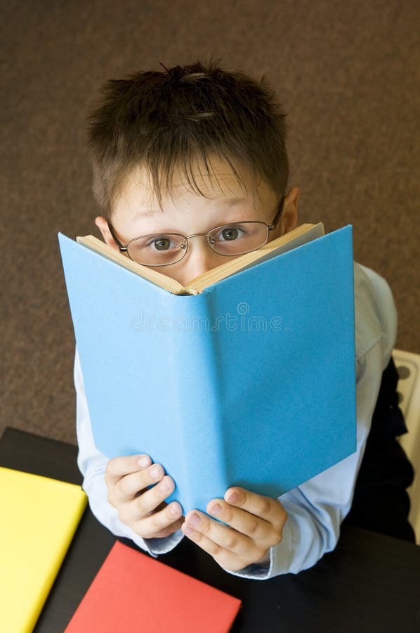 Boy Reading in Library stock photo. Image of student, library - 1830676