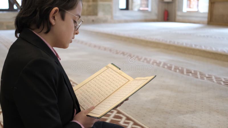 Boy Reciting from Quran stock footage. Video of look - 245862200