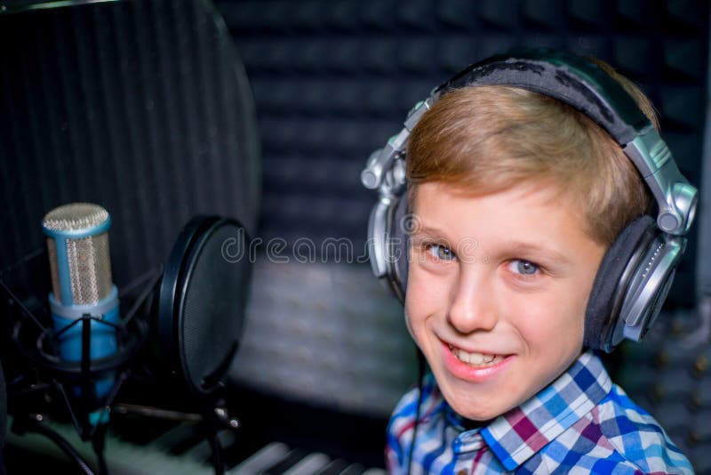 Boy in a recording studio stock photo. Image of board - 107244738