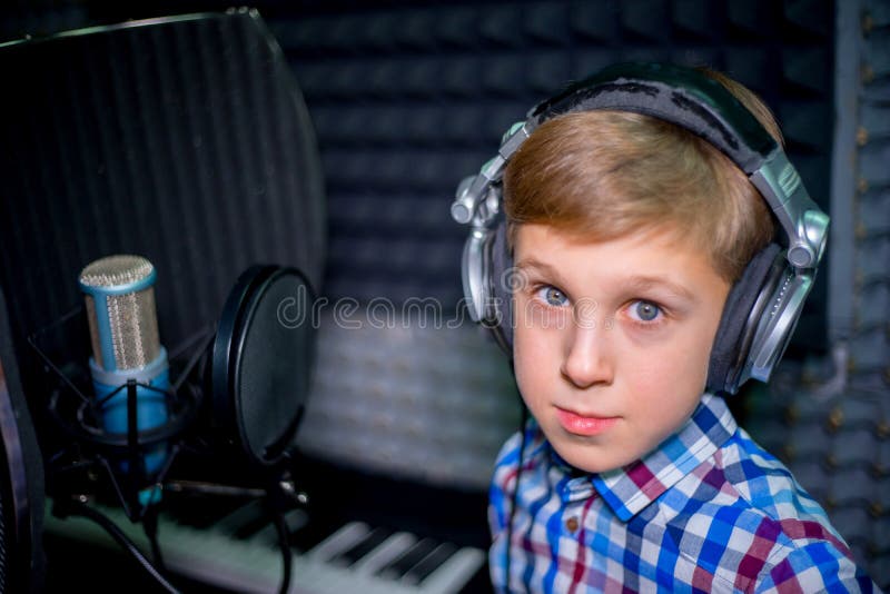 Boy in a recording studio stock photo. Image of production - 107245096