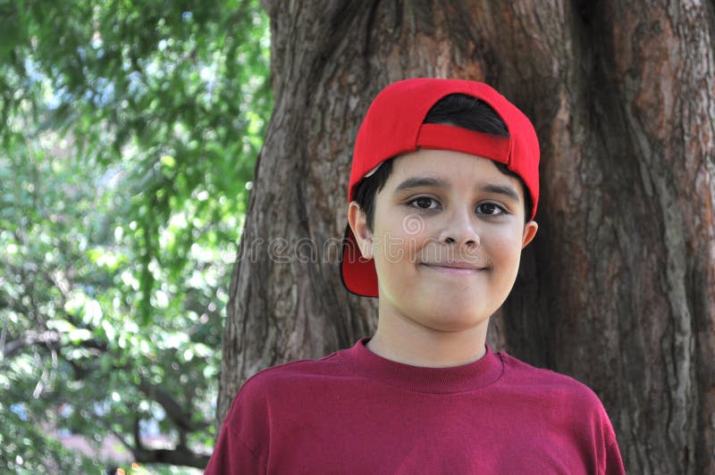 Boy in Red stock photo. Image of casual, tree, outdoor - 26137424