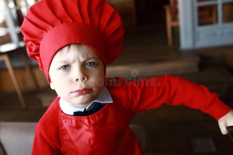 Boy in red cap cook stock image. Image of lifestyle - 141578081