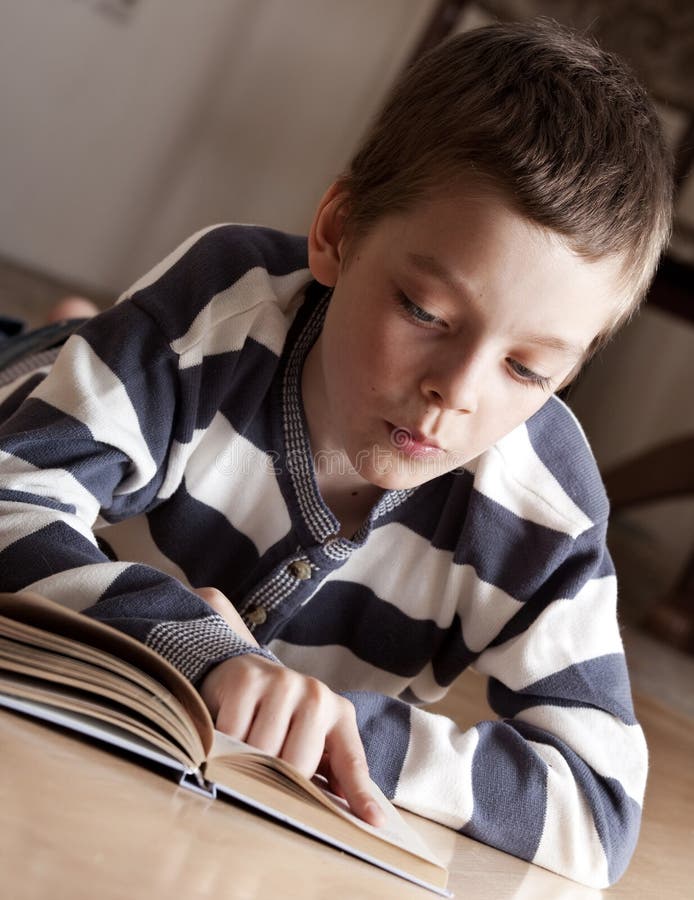 Boy reeding book stock photo. Image of concentration - 19027500