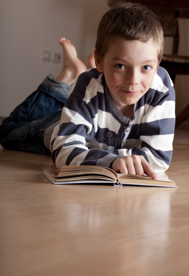 Boy reeding book stock photo. Image of home, concentrating - 19027506