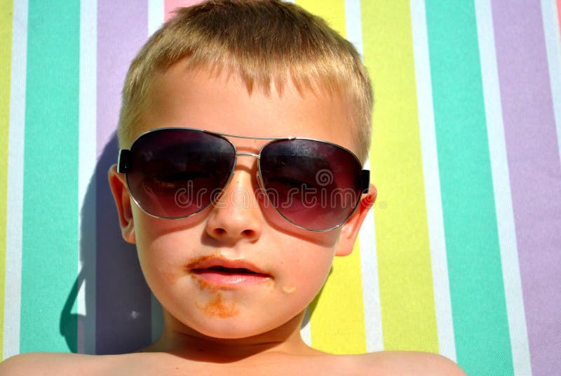 Boy Relaxing on the Sun Bed Stock Photo - Image of school, caucasian ...