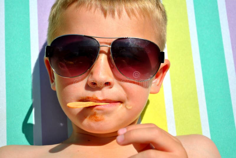 Boy Relaxing on the Sun Bed Stock Image - Image of cream, chair: 43102331