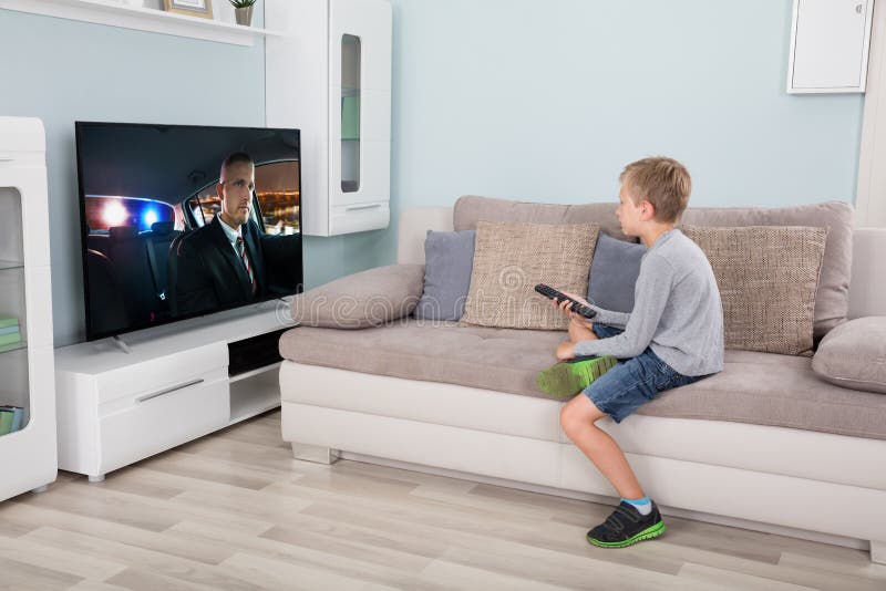 Boy with Remote Control in Front of Television Stock Image - Image of ...