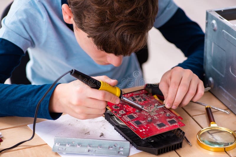 Boy Reparing Computers at Workshop Stock Photo - Image of student ...