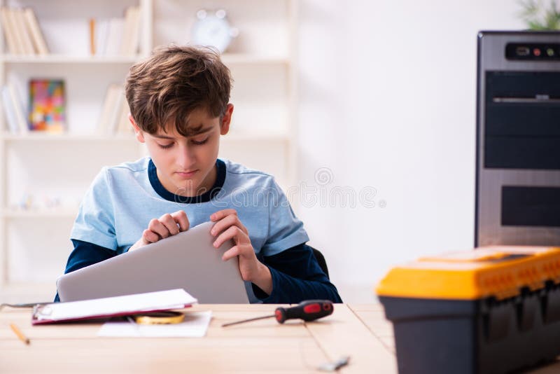 Boy Reparing Computers at Workshop Stock Image - Image of concerned ...
