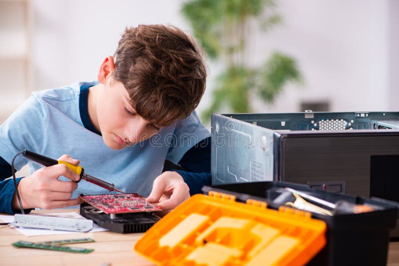 Boy Reparing Computers at Workshop Stock Image - Image of hardware ...