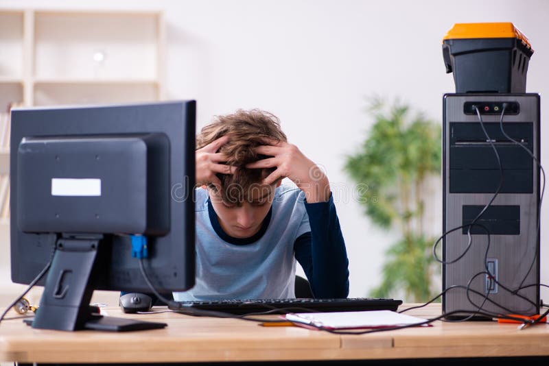Boy Reparing Computers at Workshop Stock Photo - Image of concerned ...