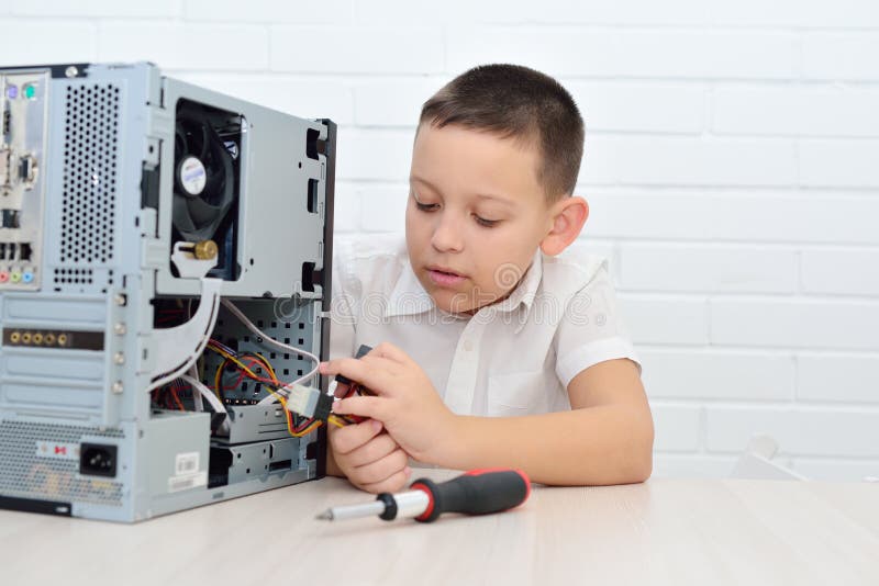 A boy repear the computer stock image. Image of electronic - 173614509
