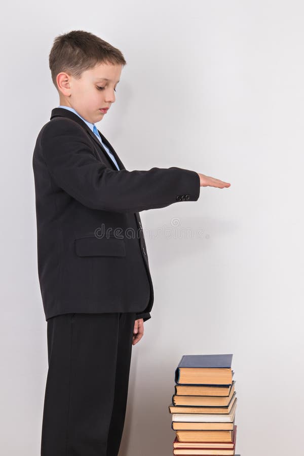 Boy Representing How Much he Has To Read Books Stock Image - Image of ...