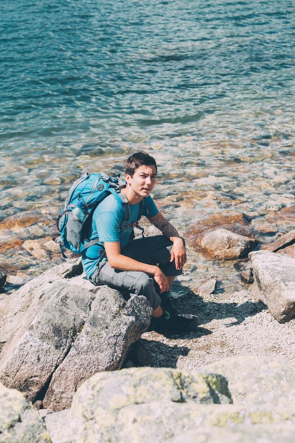 Boy resting at the lake stock photo. Image of vacation - 58507650