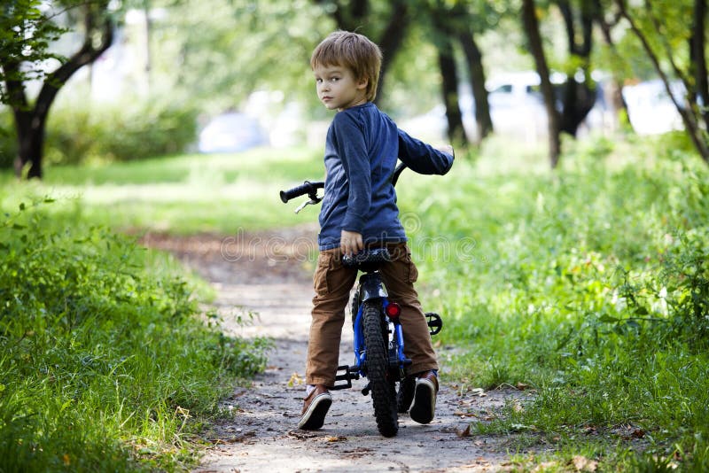 Boy Ride a Bicycle in City Park Stock Image - Image of cute, family ...