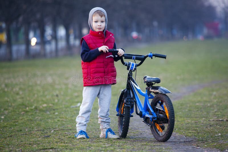 Boy Ride a Bicycle in City Park Stock Photo - Image of outdoor, helmet ...