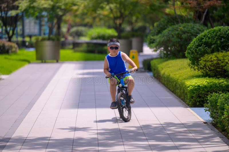 Boy ride on a bicycle stock image. Image of bicycle - 286486717