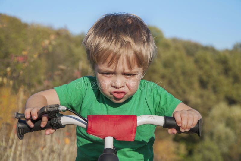 A Boy Rides a Bicycle. he is Purposefully and Confidently Moving ...