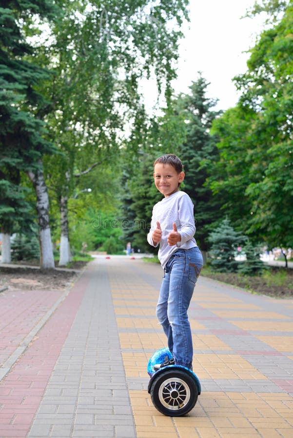 A boy rides gyroscooter stock image. Image of electrical - 161717311