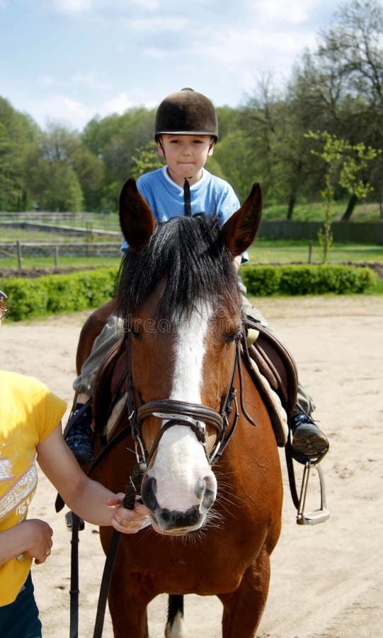 Boy rides on a horse stock photo. Image of horseback, child - 5294968