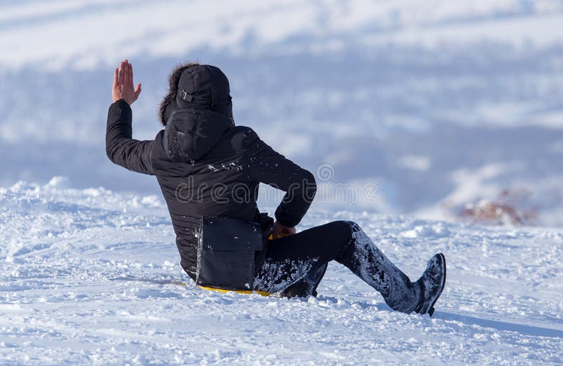 The Boy Rides a Sled from the Mountain in Winter Stock Image - Image of ...