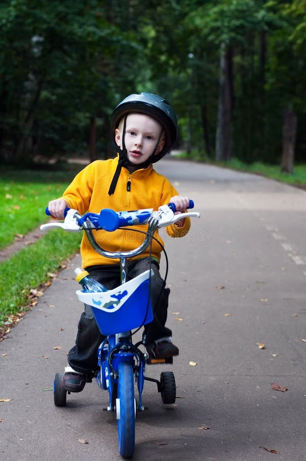Boy riding bicycle stock photo. Image of playing, enjoyment - 10914986