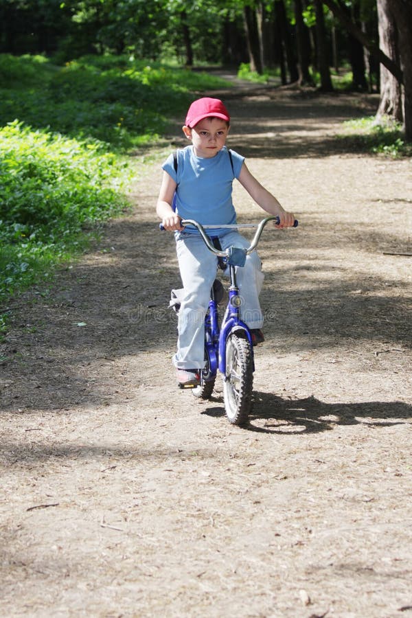 Boy riding bicycle stock image. Image of activity, child - 14416459