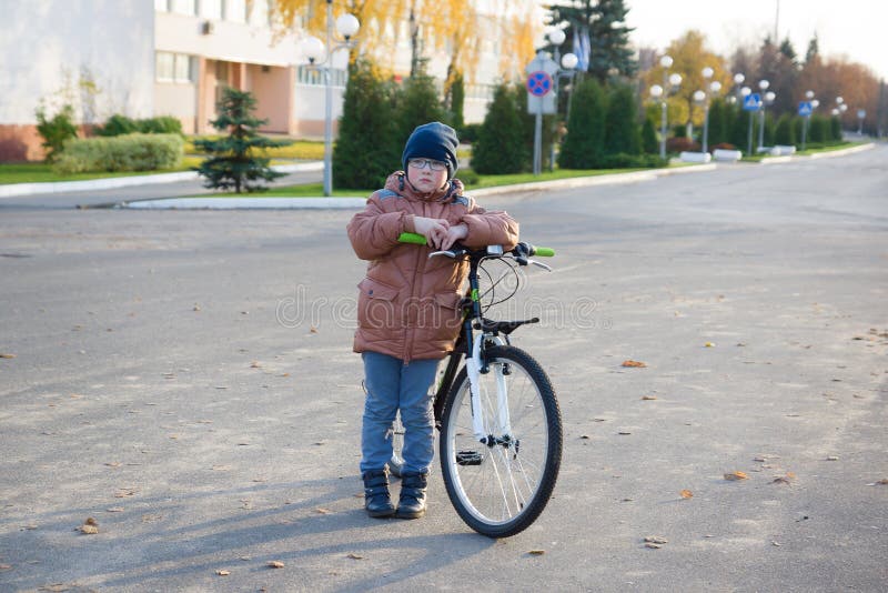 Boy is riding a bicycle stock image. Image of biking - 113440121