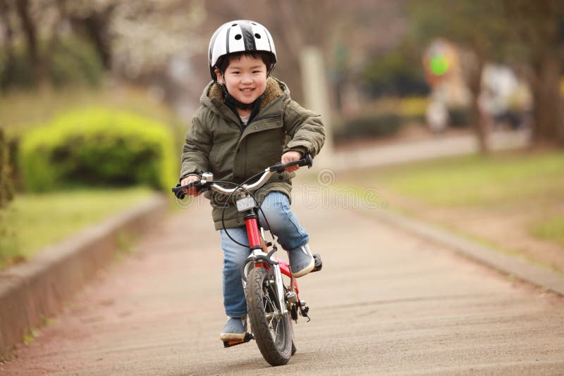 Boy riding a bicycle stock image. Image of boys, leisure - 238429439