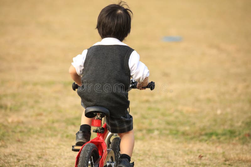 Boy riding a bicycle stock image. Image of cycling, bicycle - 238850633