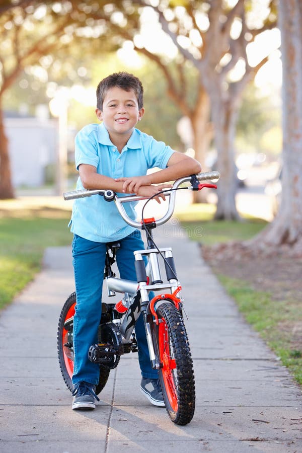 Boy Riding Bike on Path stock photo. Image of portrait - 29683688
