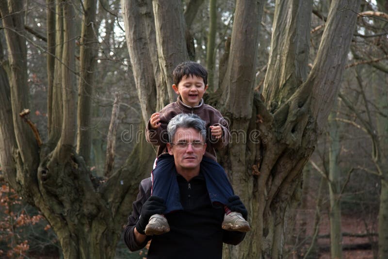 Man Carrying Girl Over His Shoulders Stock Photo - Image of people ...