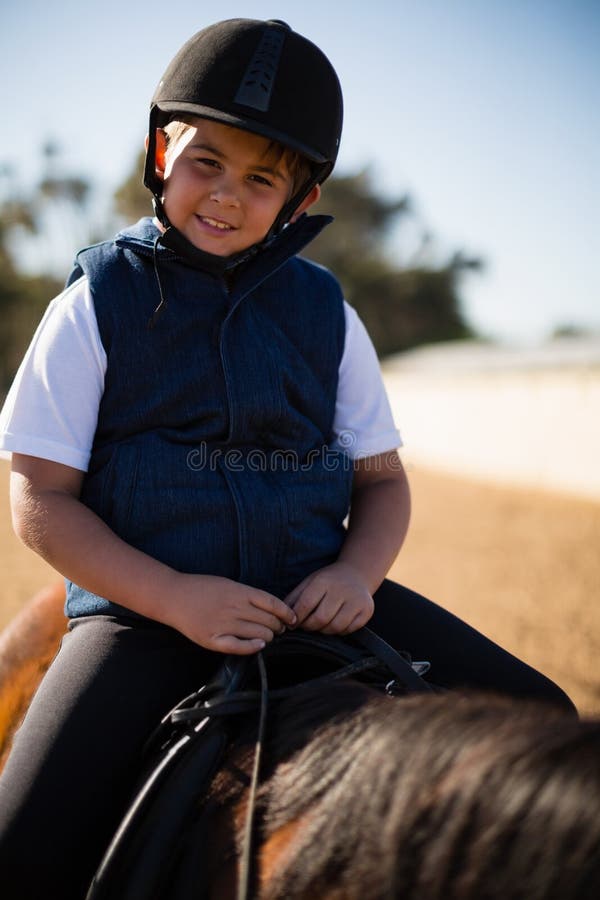 Boy Riding a Horse in the Ranch Stock Photo - Image of holiday ...