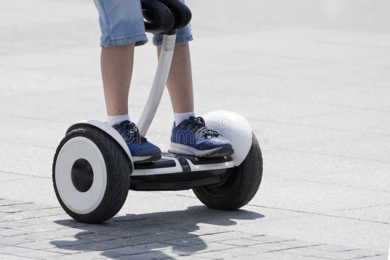 Boy Riding on the Hoverboard in the Park. a New Ride Technologies Stock ...