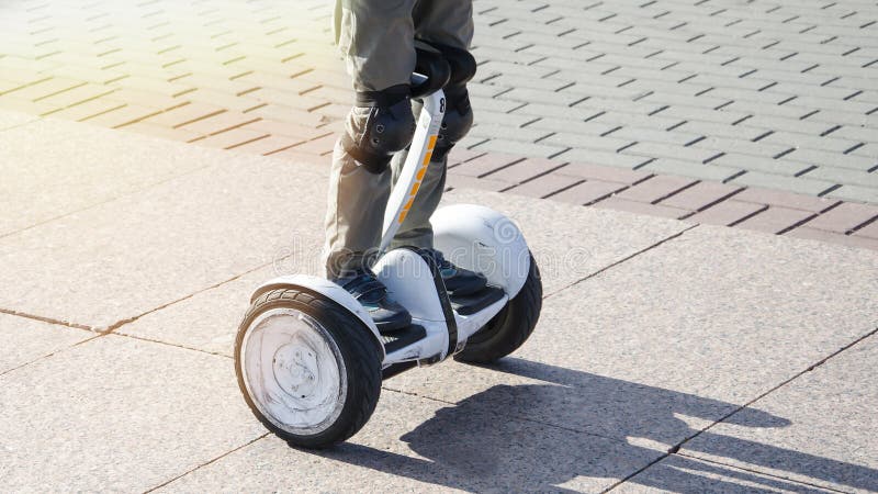 Boy Riding a Hoverboard in the Square Stock Photo - Image of rays ...