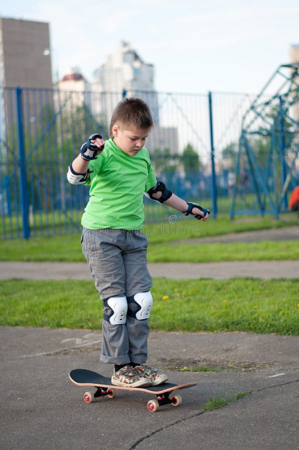 Boy riding a skateboard stock image. Image of nine, skater - 24846797