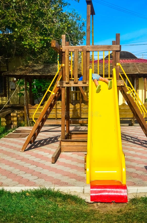 The Yellow Slide at the Playground. Stock Image - Image of steps ...