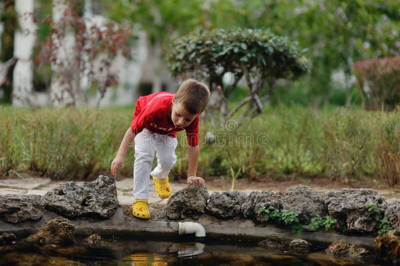 Boy at the river stock image. Image of wave, back, person - 26737947