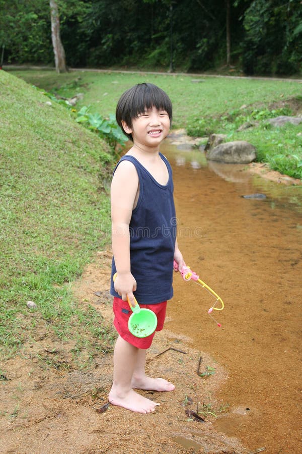 Boy at the river stock image. Image of meadow, kids, chinese - 5454091