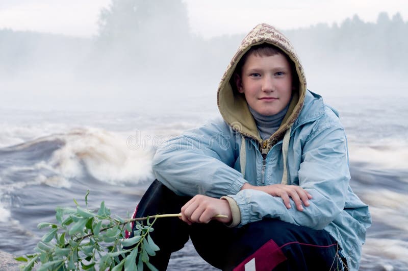 Boy on river bank stock image. Image of water, adult - 10678267